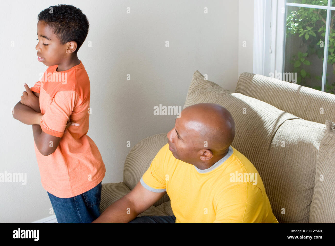 African American father having difficulty parenting his son Stock Photo ...