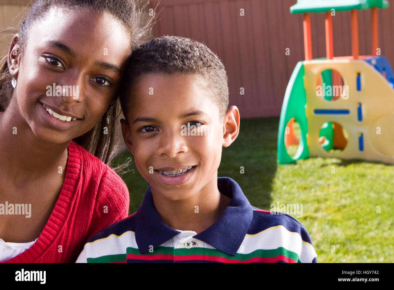Happy African American brother and sister smiling Stock Photo - Alamy