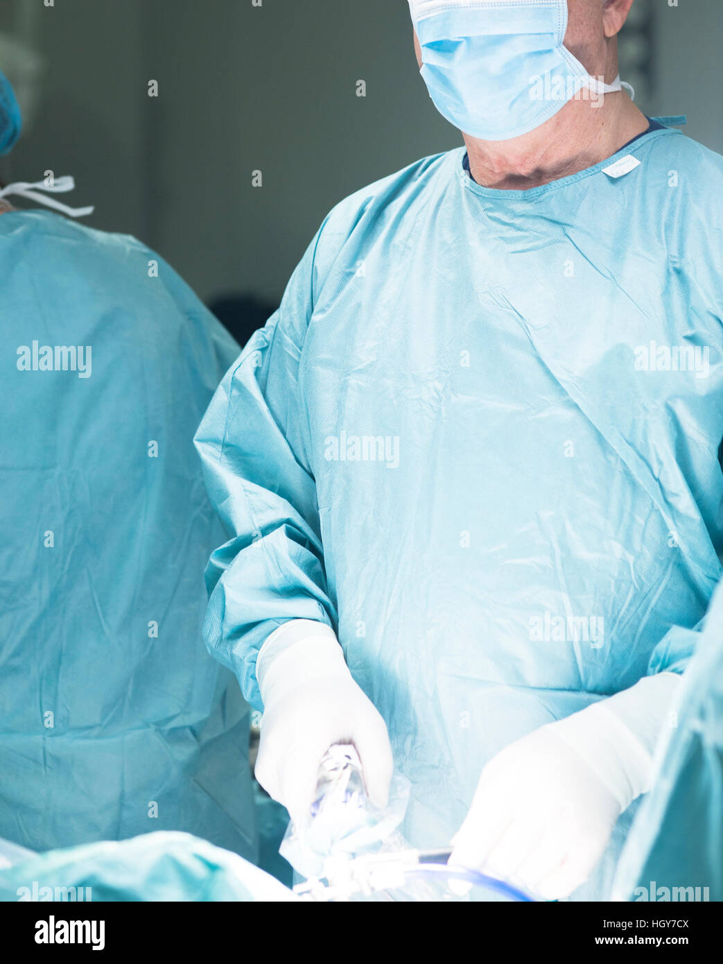 Surgeon in hospital surgery in sterile uniform "scrubs" in operating ...