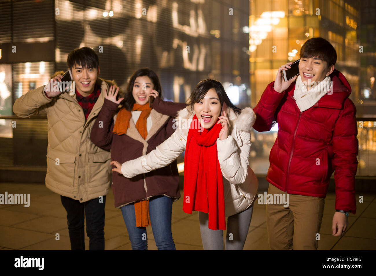 Talking on cell phones hi-res stock photography and images - Alamy