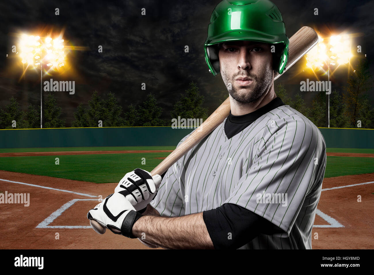 Baseball Player on a Green Uniform on baseball Stadium Stock Photo - Alamy
