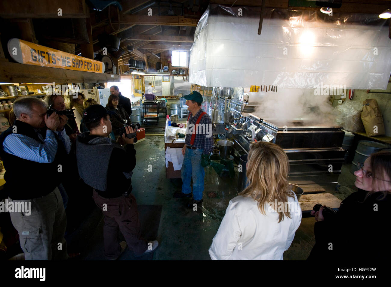 Paul Messer, Sr. explains how he makes maple syrup to a tour group in ...