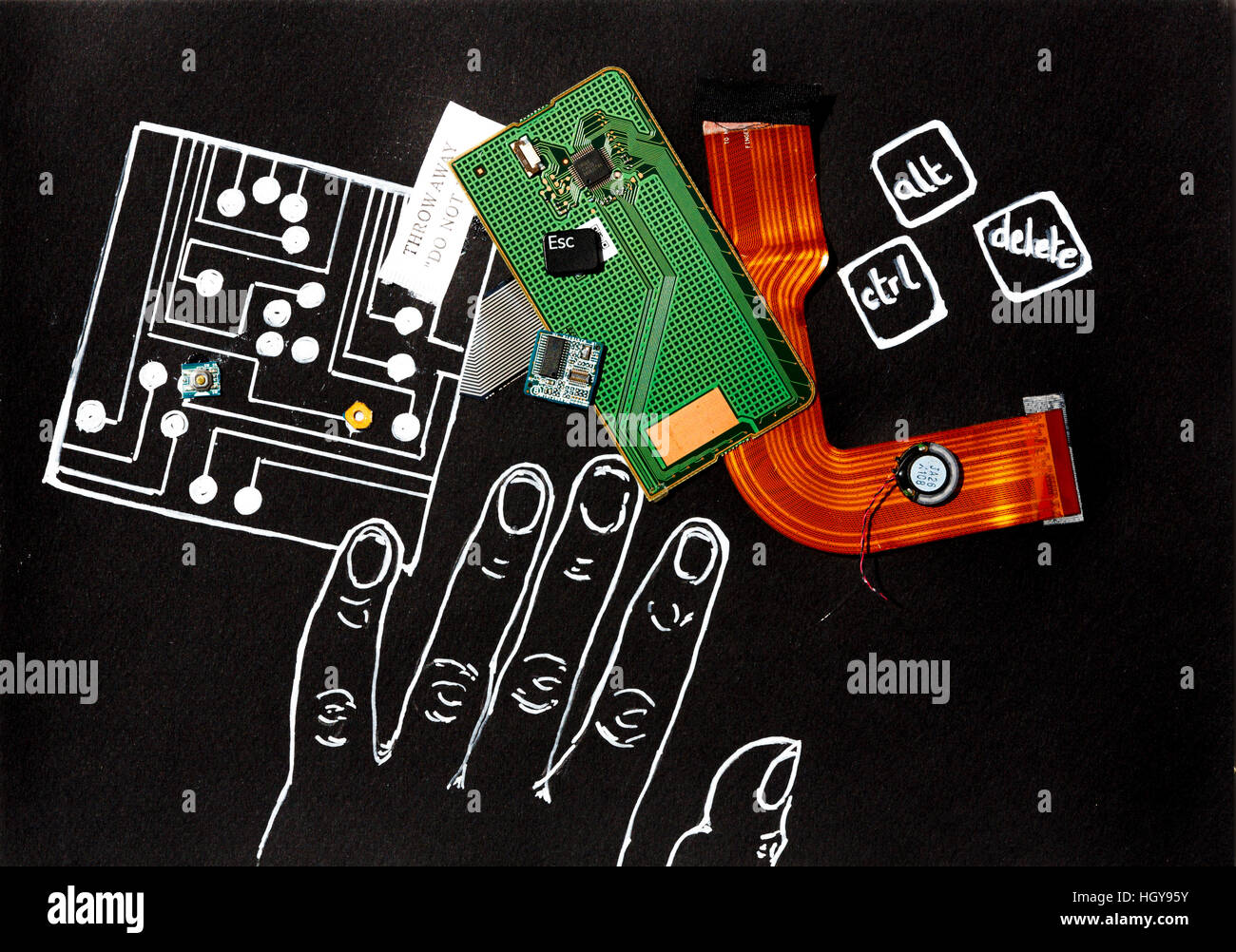 Computer circuit board and pieces laid on a drawing of an outline of a ...
