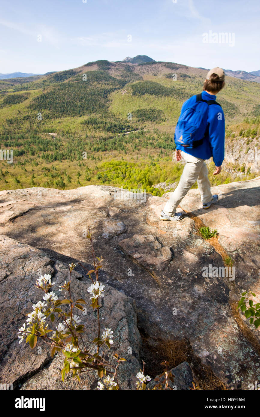 A hiker on the Boulder Loop Trail in New Hampshire's White Mountains ...