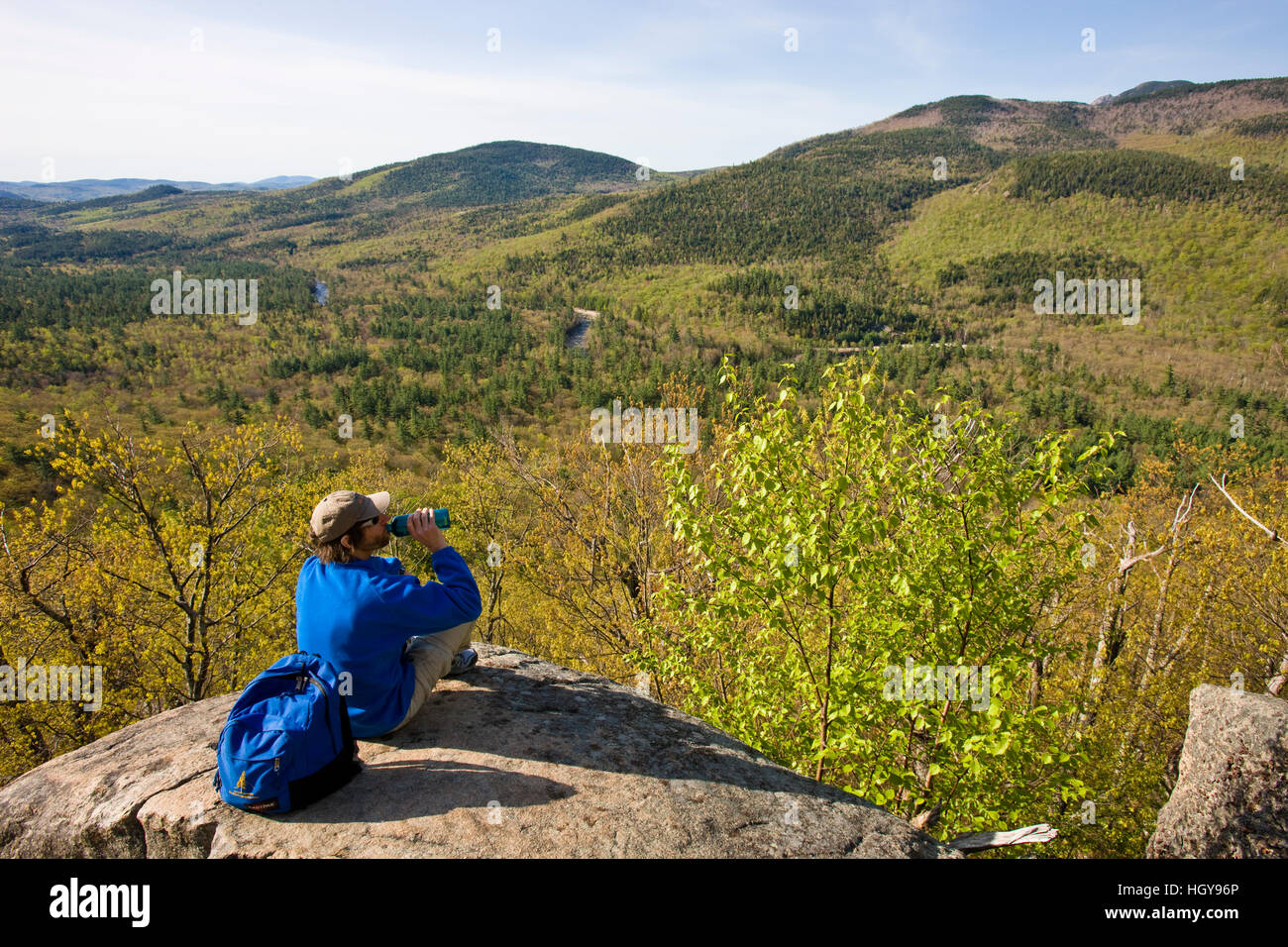 A hiker on the Boulder Loop Trail in New Hampshire's White Mountains ...