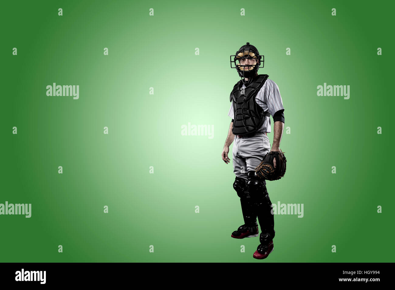 Catcher Baseball Player on a Green background Stock Photo - Alamy