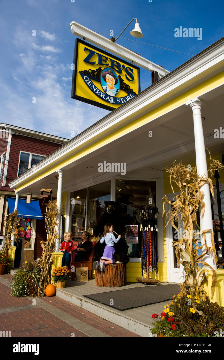A young girl (age 6) and boy (age 4) play outside Zeb's Country Store ...