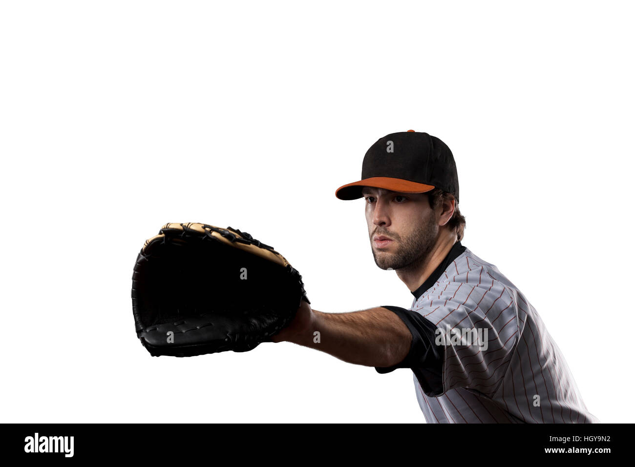 Baseball Player in a Orange uniform, on a white background Stock Photo ...