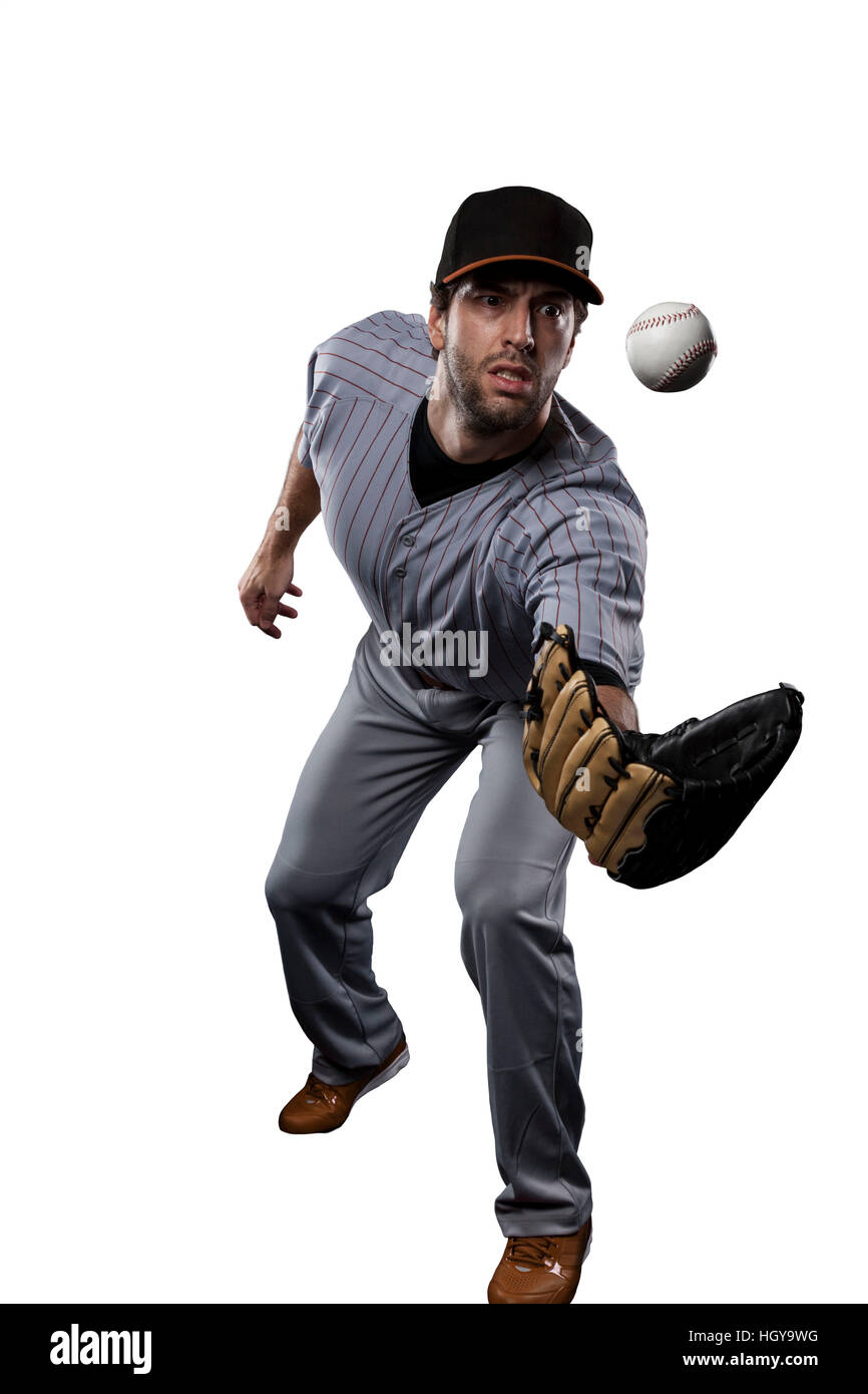 Baseball Player in a Orange uniform, on a white background Stock Photo ...
