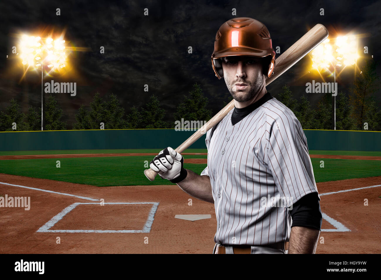 Baseball Player on a Orange Uniform on baseball Stadium Stock Photo - Alamy