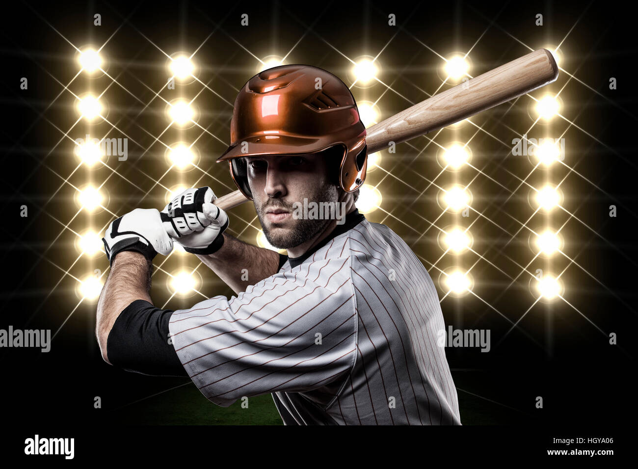 Baseball Player on a Orange Uniform on baseball Stadium Stock Photo - Alamy