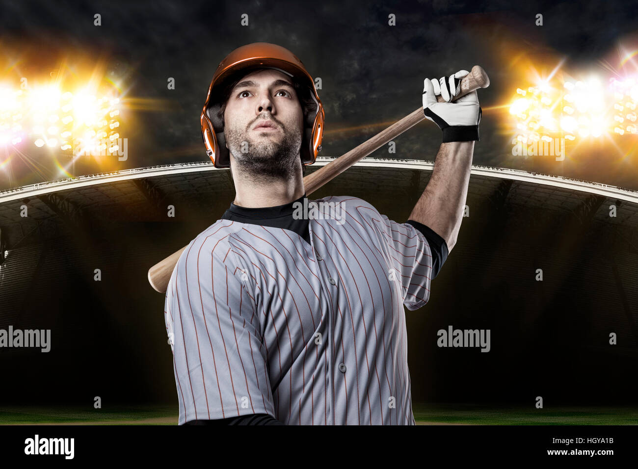 Baseball Player on a Orange Uniform on baseball Stadium Stock Photo - Alamy