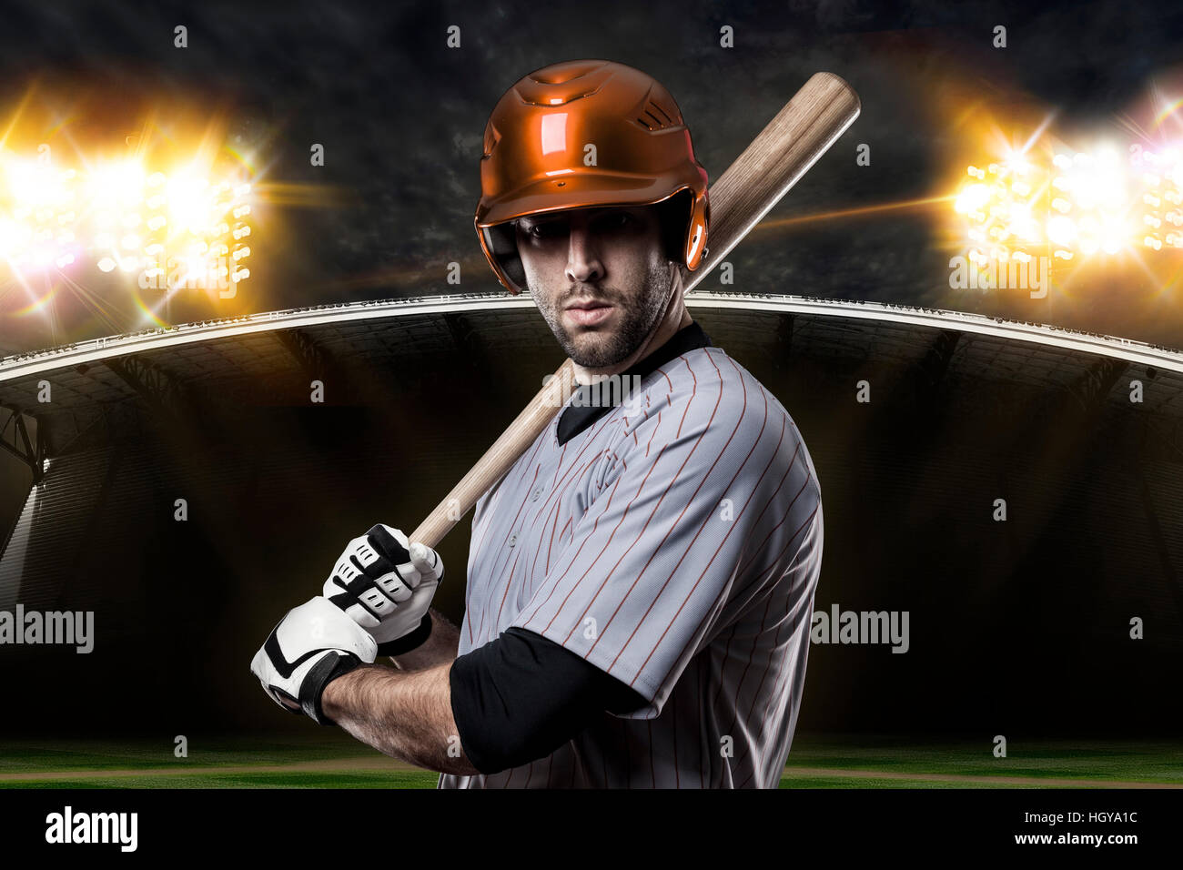 Baseball Player on a Orange Uniform on baseball Stadium Stock Photo - Alamy