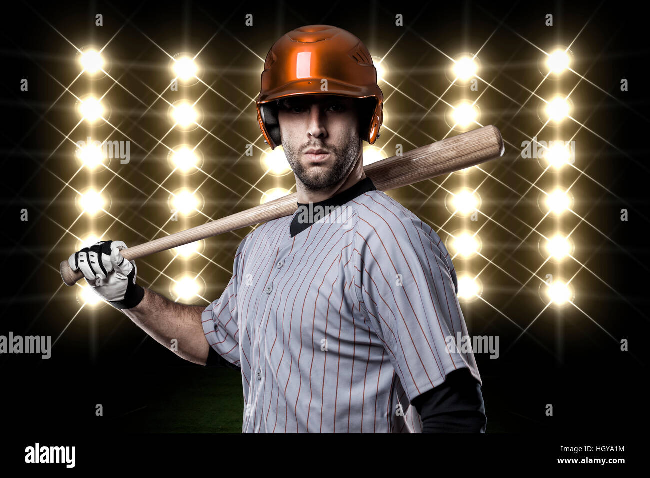 Baseball Player on a Orange Uniform on baseball Stadium Stock Photo - Alamy