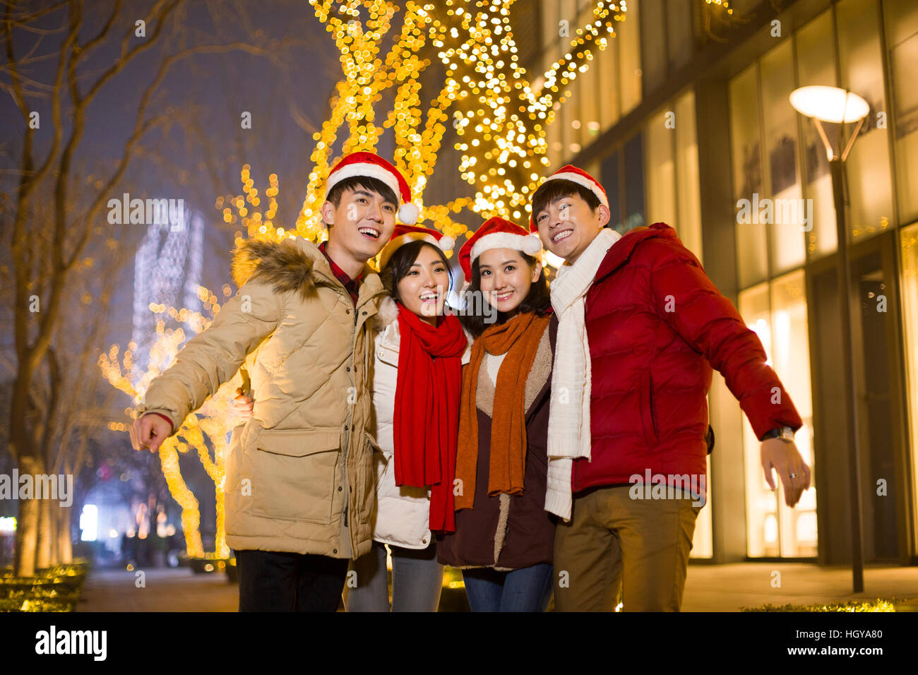 Celebrating christmas happy friends hi-res stock photography and images ...