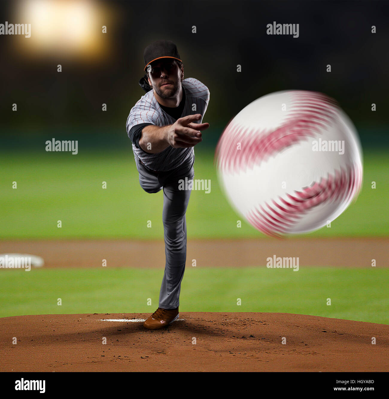 Pitcher Baseball Player on a Orange Uniform on baseball Stadium Stock ...