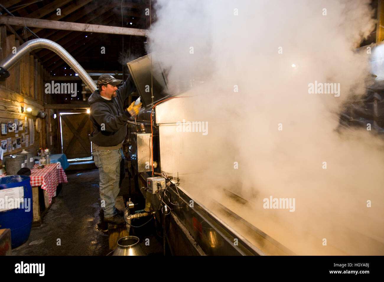 Ralph Luce tending the sap evaporator in his sugar house at Sugarbush ...