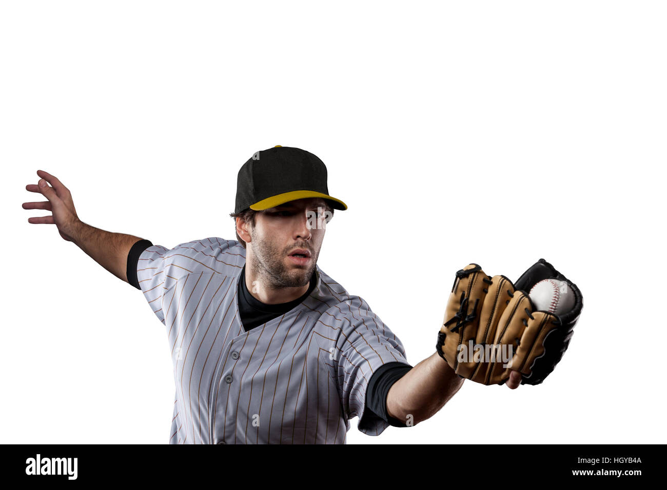 Baseball Player in a Yellow uniform, on a white background Stock Photo ...