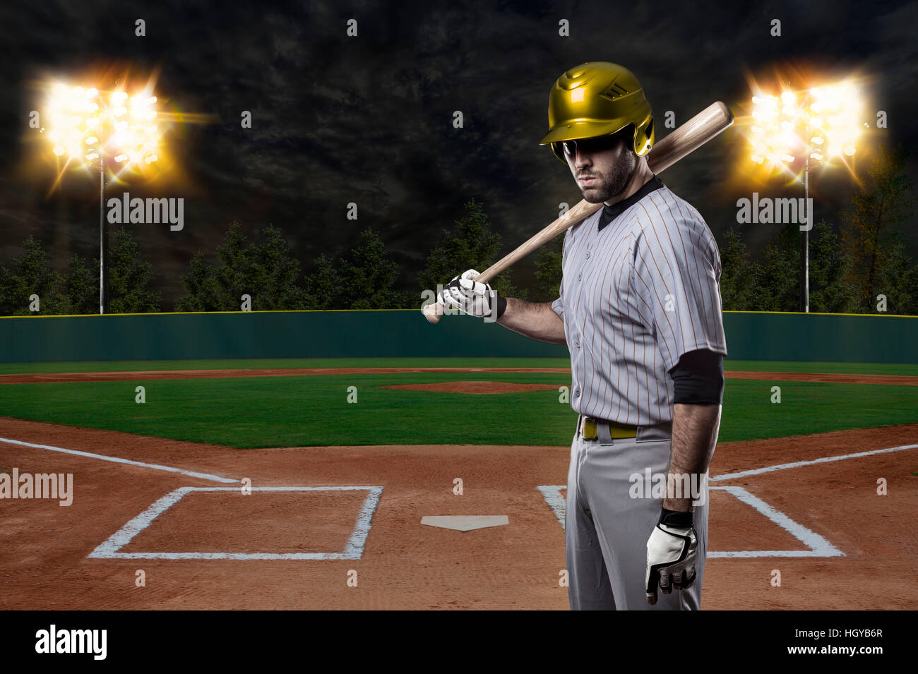 Baseball Player on a Yellow Uniform on baseball Stadium Stock Photo - Alamy