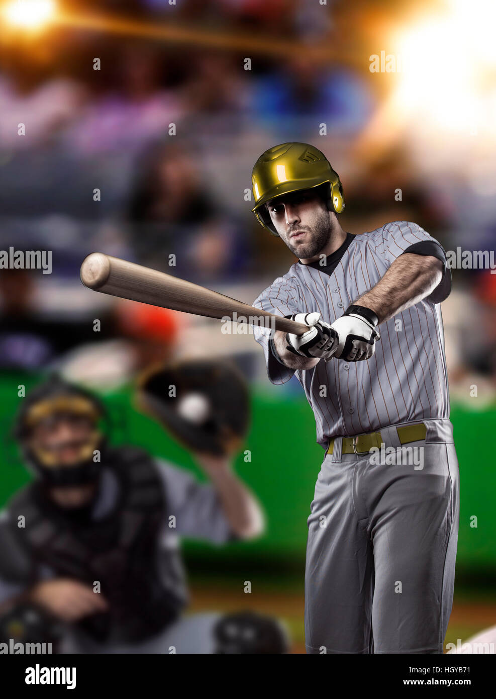 Baseball Player on a Yellow Uniform on baseball Stadium Stock Photo - Alamy
