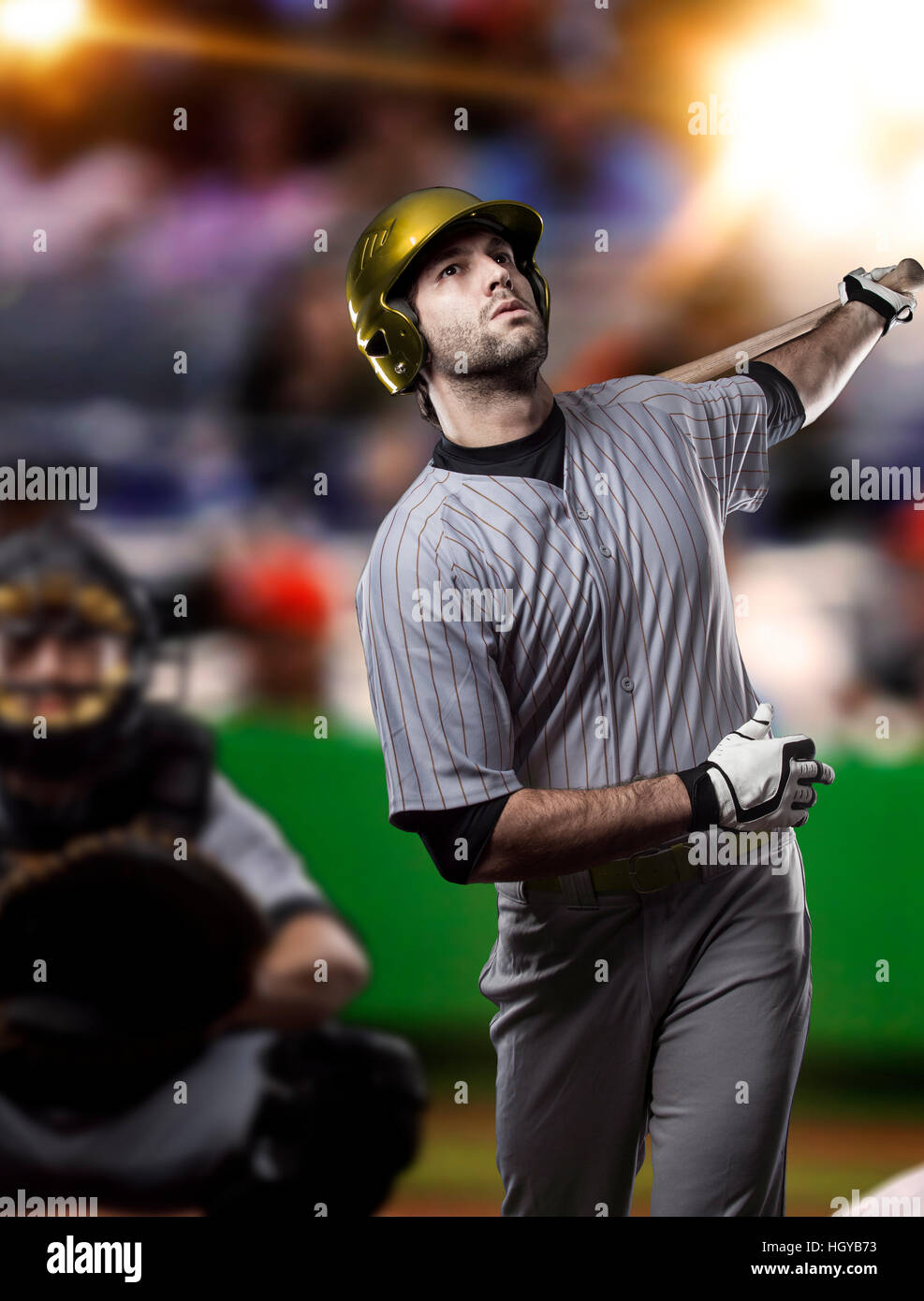 Baseball Player on a Yellow Uniform on baseball Stadium Stock Photo - Alamy