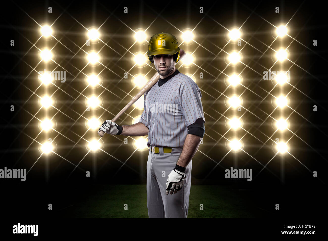 Baseball Player on a Yellow Uniform on baseball Stadium Stock Photo - Alamy