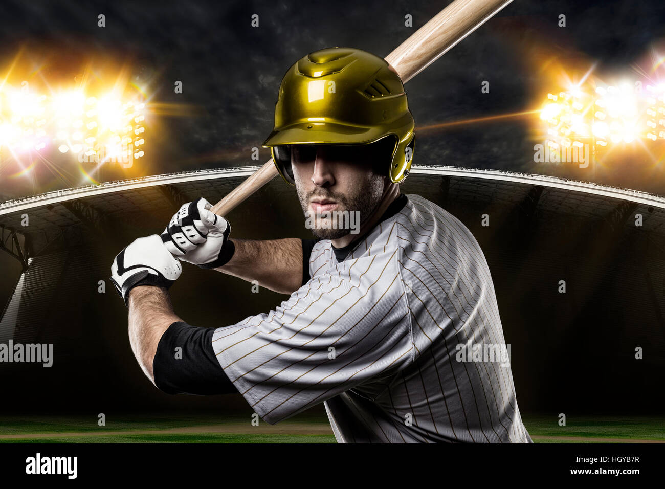 Baseball Player on a Yellow Uniform on baseball Stadium Stock Photo - Alamy