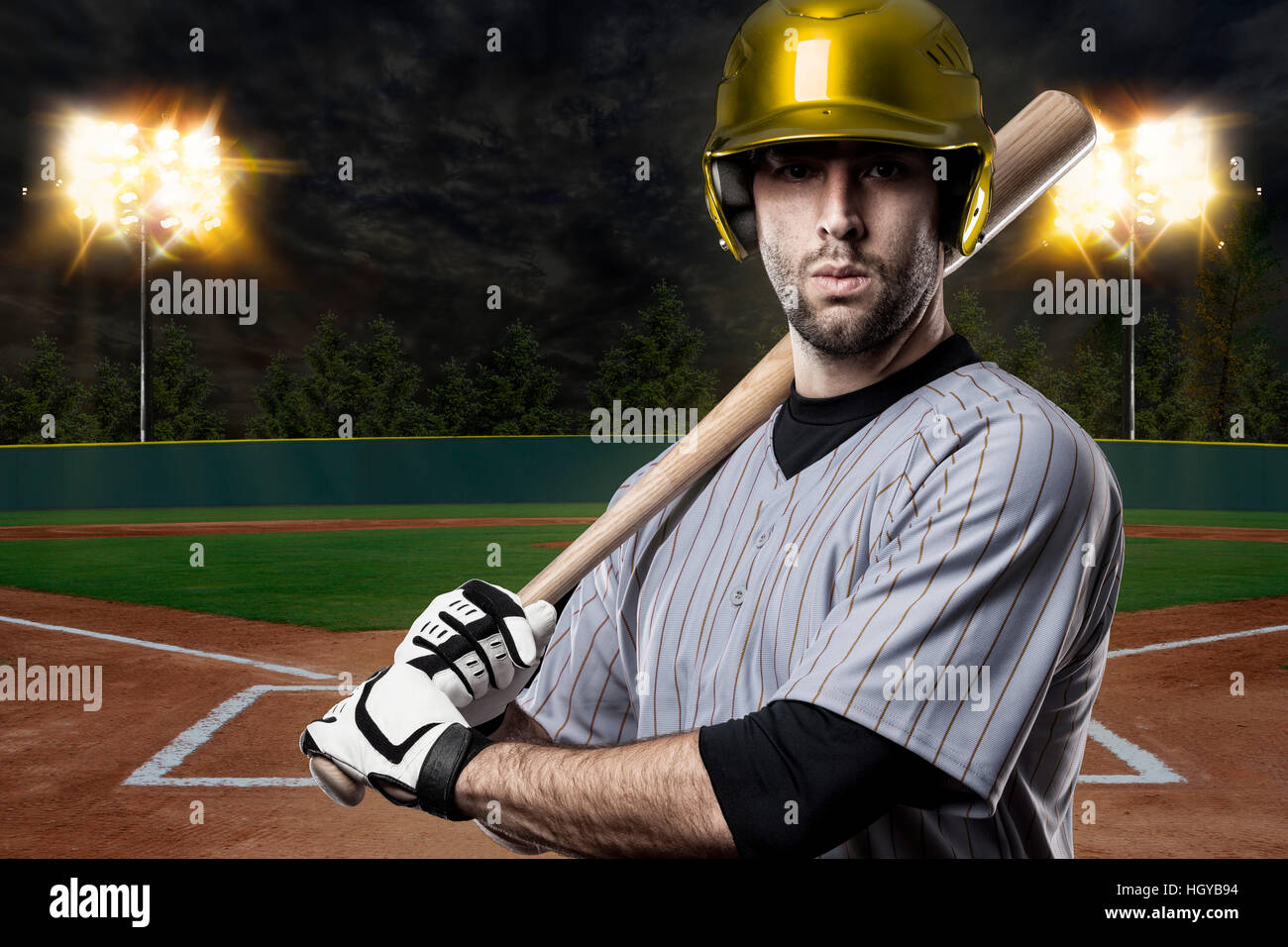 Baseball Player on a Yellow Uniform on baseball Stadium Stock Photo - Alamy