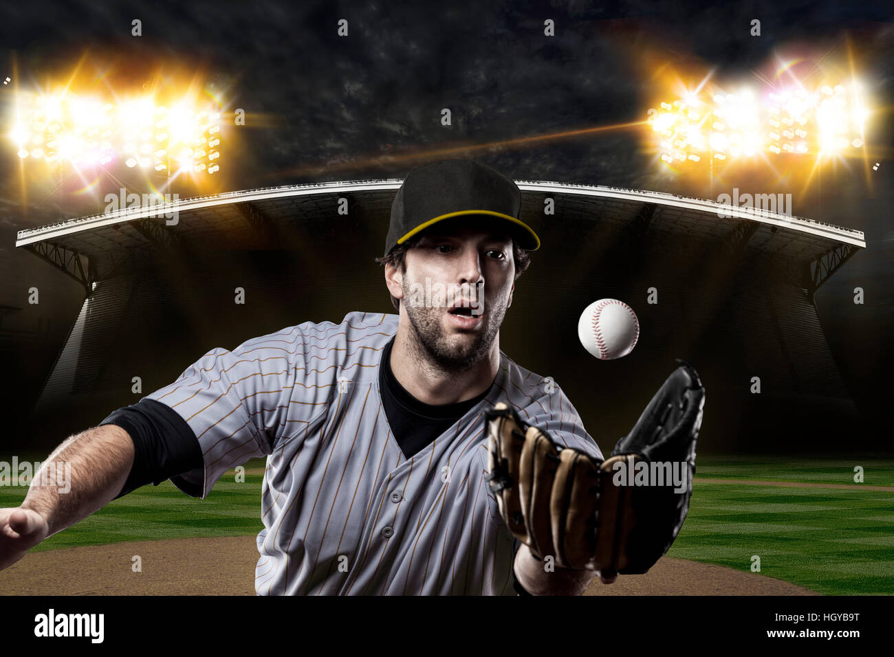 Baseball Player on a Yellow Uniform on baseball Stadium Stock Photo - Alamy