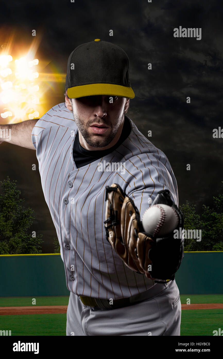 Baseball Player on a Yellow Uniform on baseball Stadium Stock Photo - Alamy