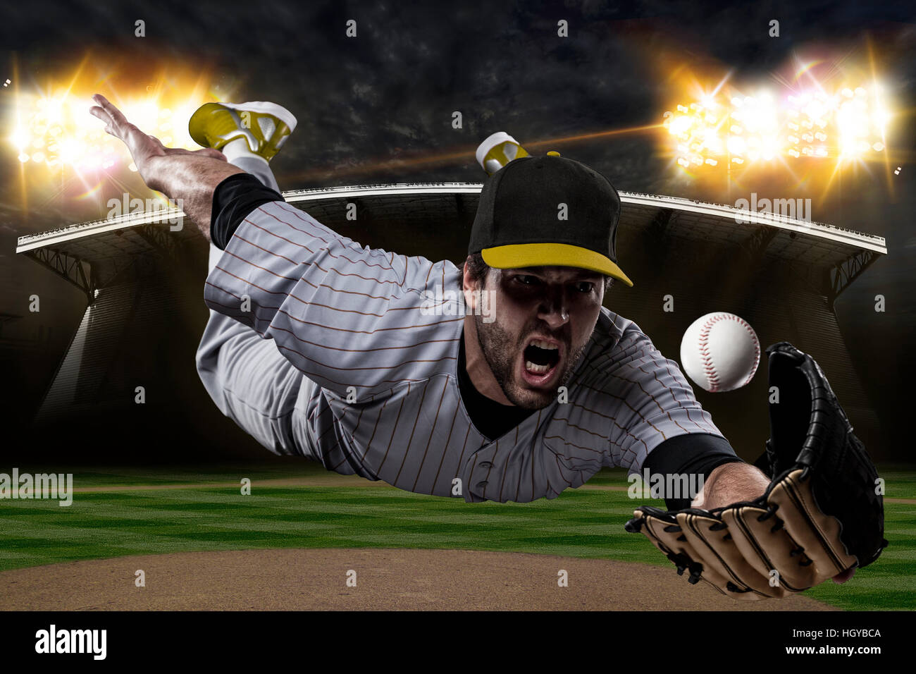 Baseball Player on a Yellow Uniform on baseball Stadium Stock Photo - Alamy