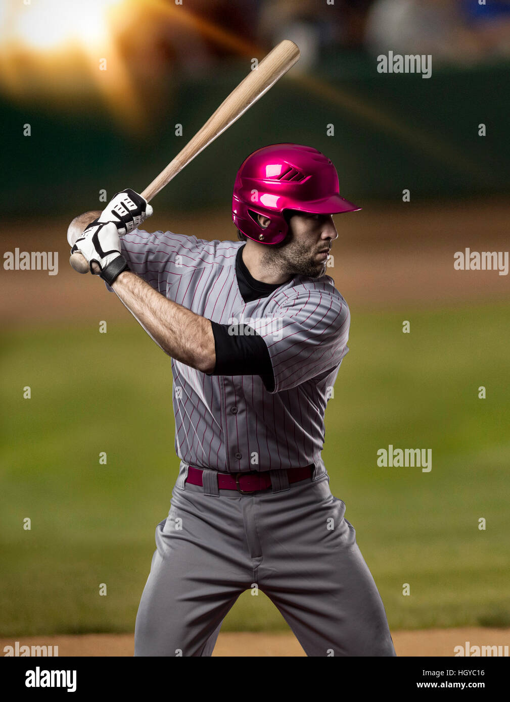 Baseball Player on a Pink Uniform on baseball Stadium Stock Photo - Alamy
