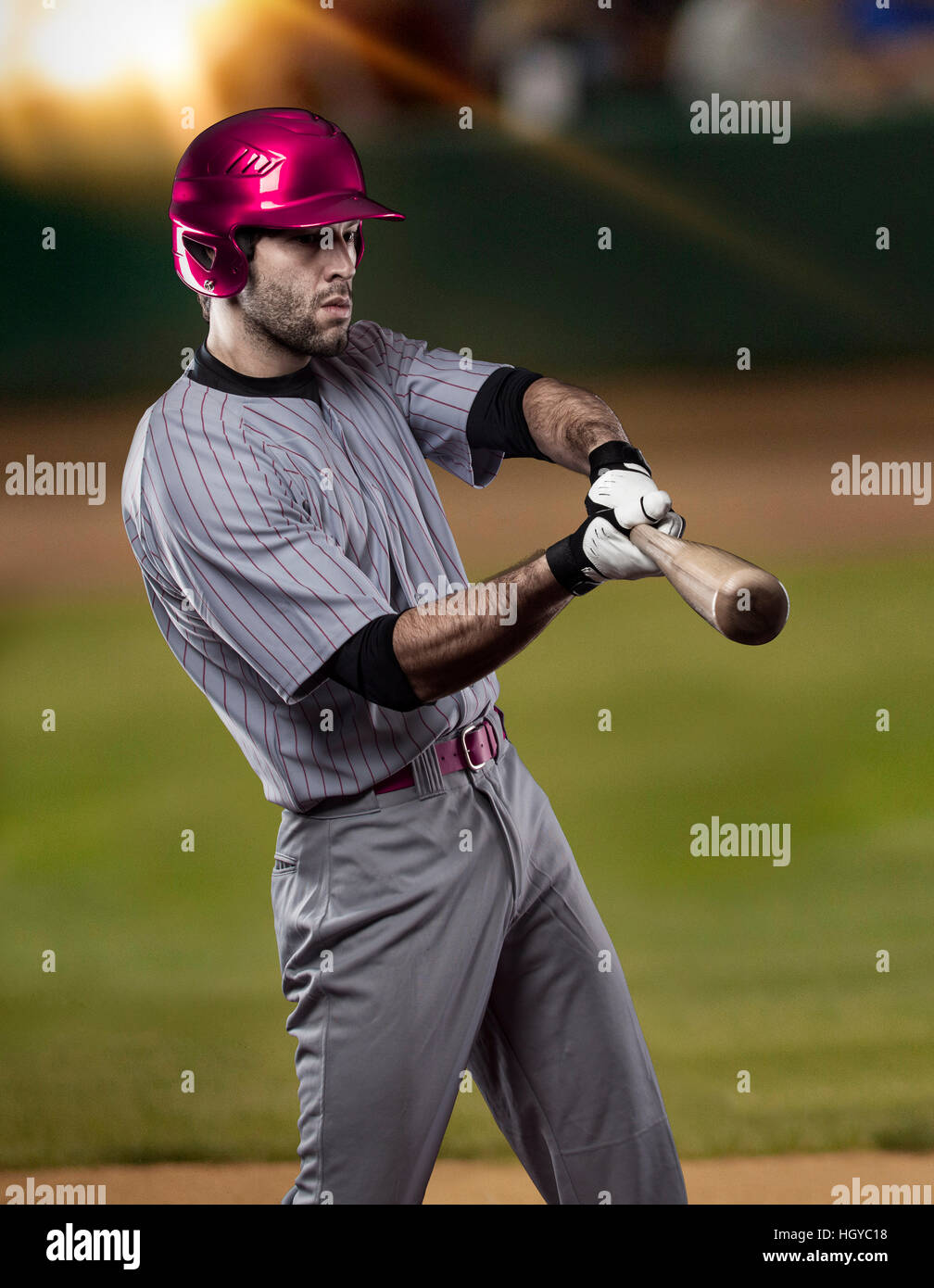 Baseball Player on a Pink Uniform on baseball Stadium Stock Photo - Alamy
