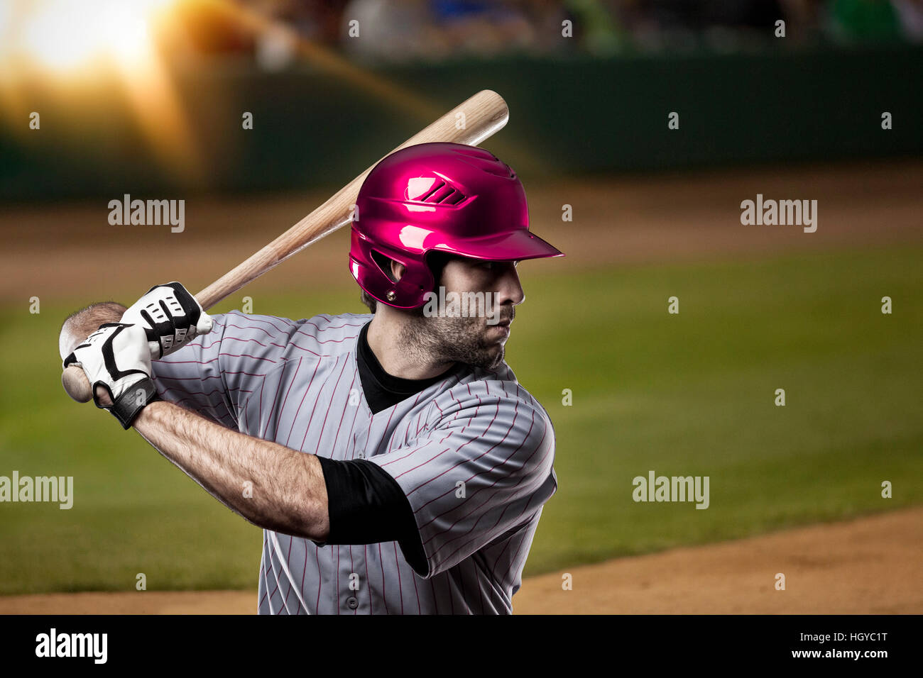 Baseball Player on a Pink Uniform on baseball Stadium Stock Photo - Alamy