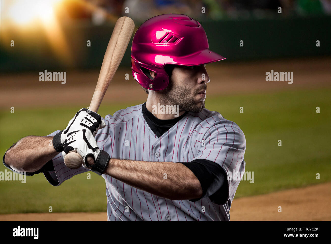 Baseball Player on a Pink Uniform on baseball Stadium Stock Photo - Alamy