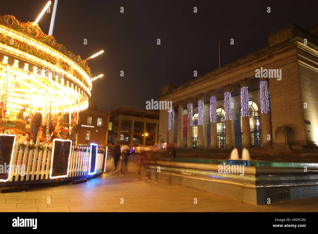 'Gallopers' fairground ride in full swing next to festive City Hall (r ...