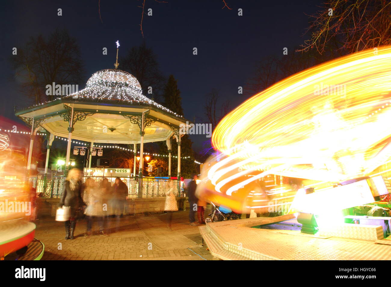 Funfair rides by the decorated bandstand in Hall Leys Park in Matlock a ...