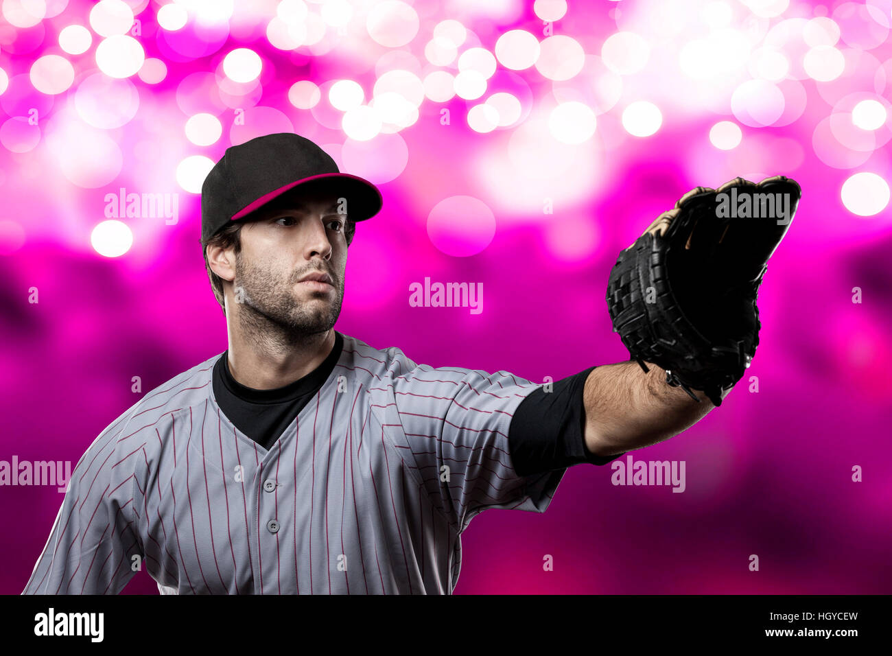 Baseball Player on a pink Uniform on pink lights background Stock Photo ...