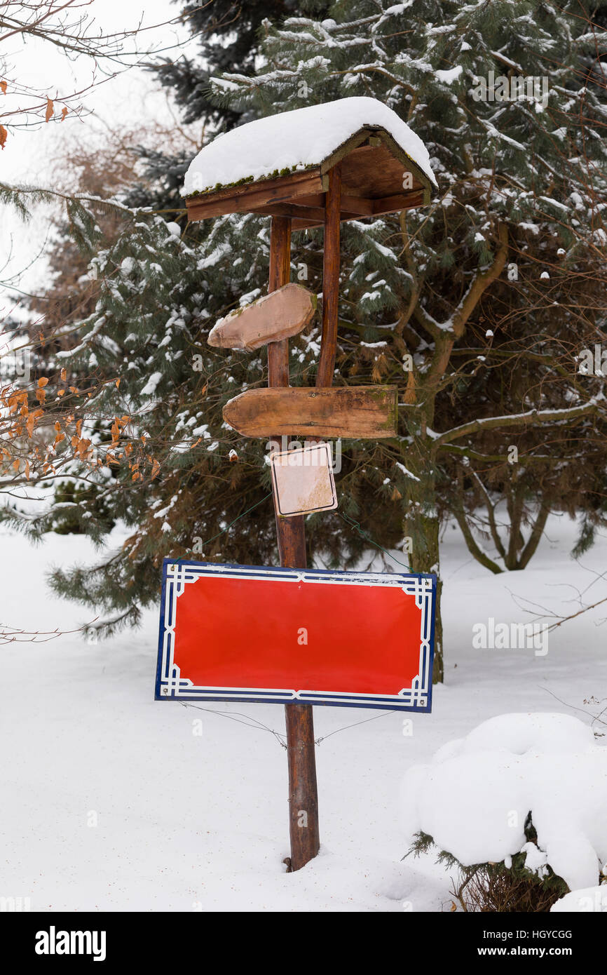 wooden empty signpost in winter garden with fresh snow Stock Photo - Alamy