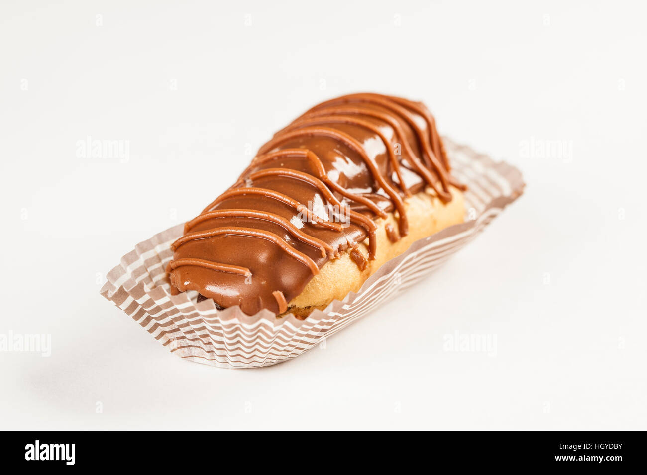 Bomba de chocolate. A Brazilian traditional eclair on a white ...