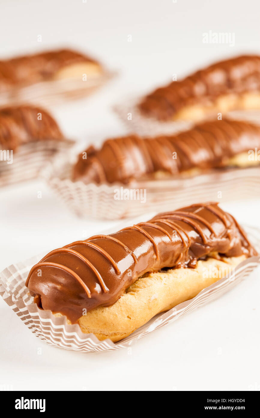 Bomba de chocolate. A Brazilian traditional eclair on a white ...