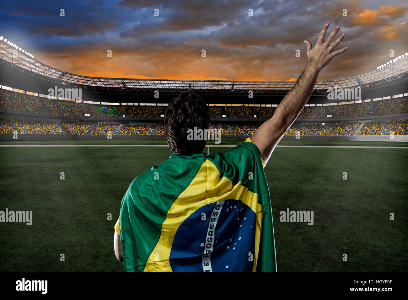 Brazilian soccer player with a Brazilian flag on his back, celebrating ...