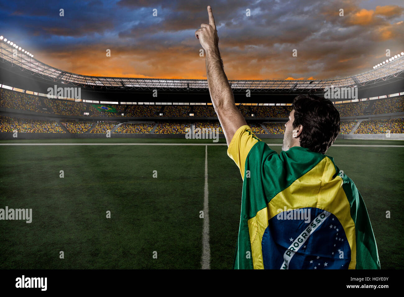 Brazilian soccer player with a Brazilian flag on his back, celebrating ...