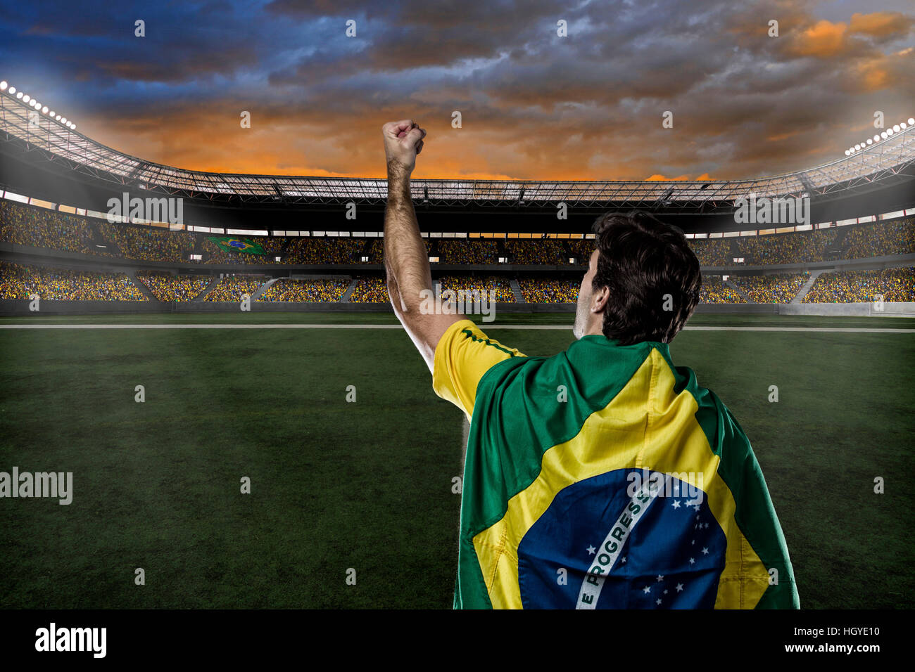 Brazilian soccer player with a Brazilian flag on his back, celebrating ...
