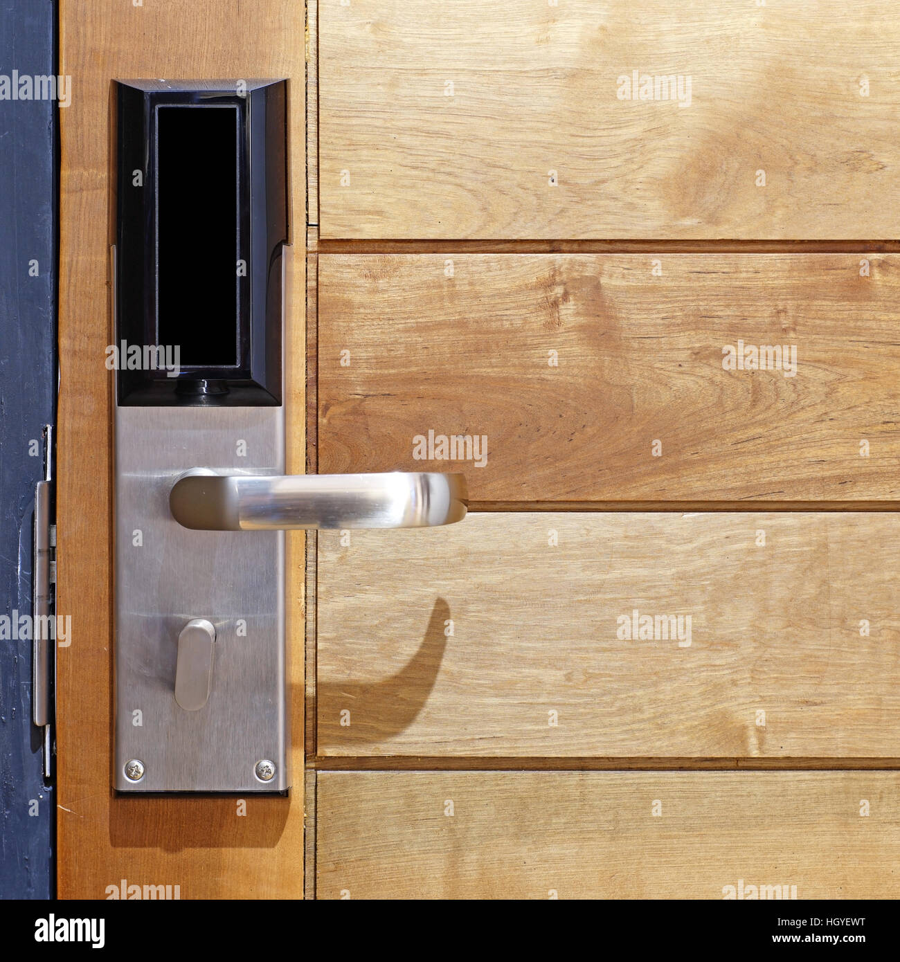 hotel electronic card lock on wooden door Stock Photo - Alamy