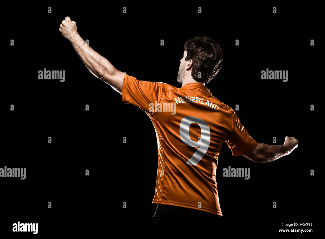 Dutchman soccer player, celebrating on the black background Stock Photo ...