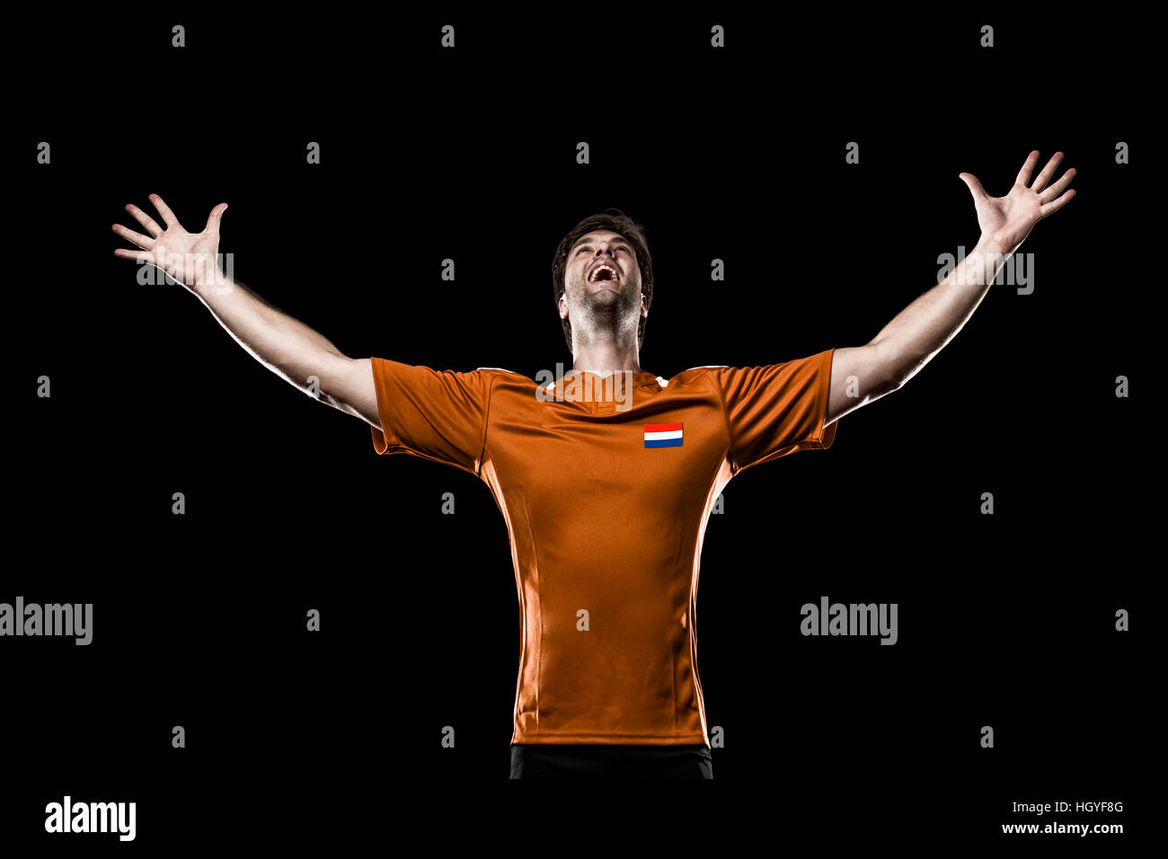 Dutchman soccer player, celebrating on the black background Stock Photo ...