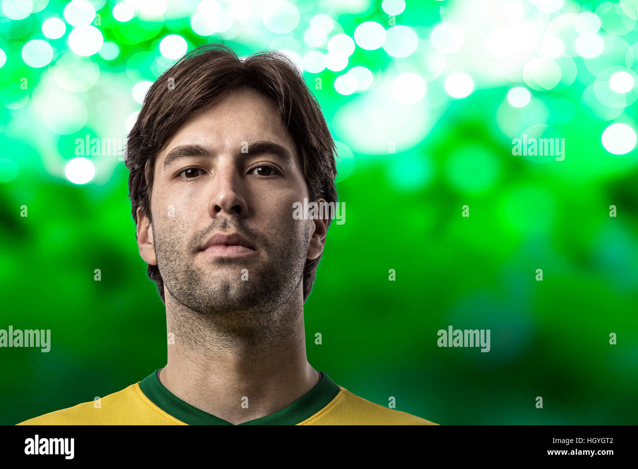 Brazilian soccer player, celebrating on a green lights background Stock ...