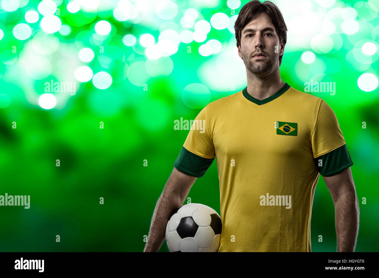 Brazilian soccer player, celebrating on a green lights background Stock ...