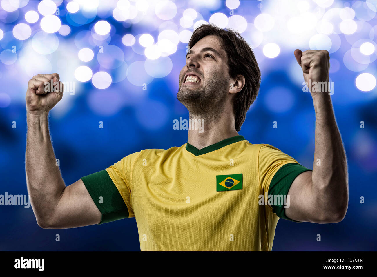 Brazilian soccer player, celebrating on a blue lights background Stock ...
